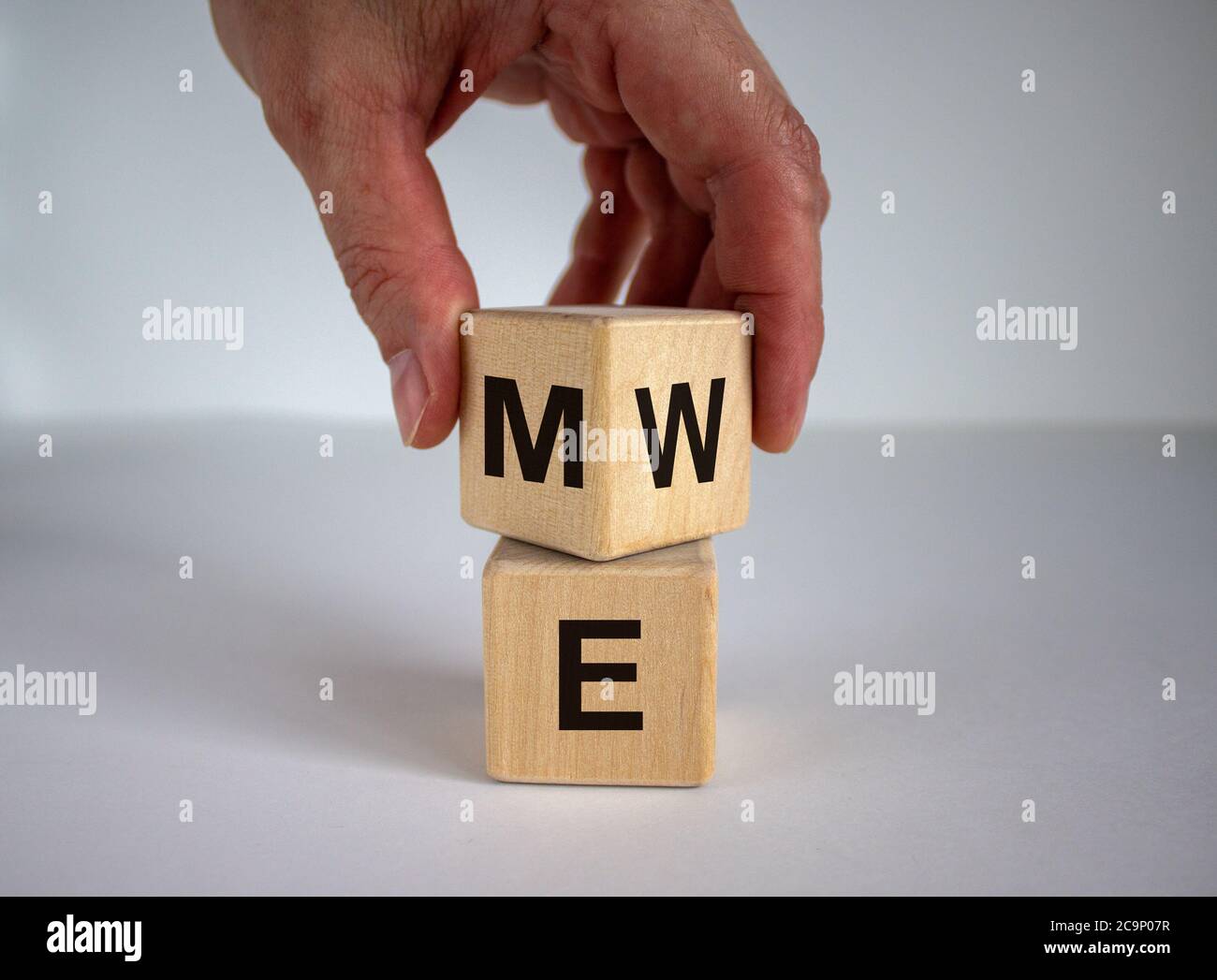 Expanded wood cube with me or we words on beautiful white background ...