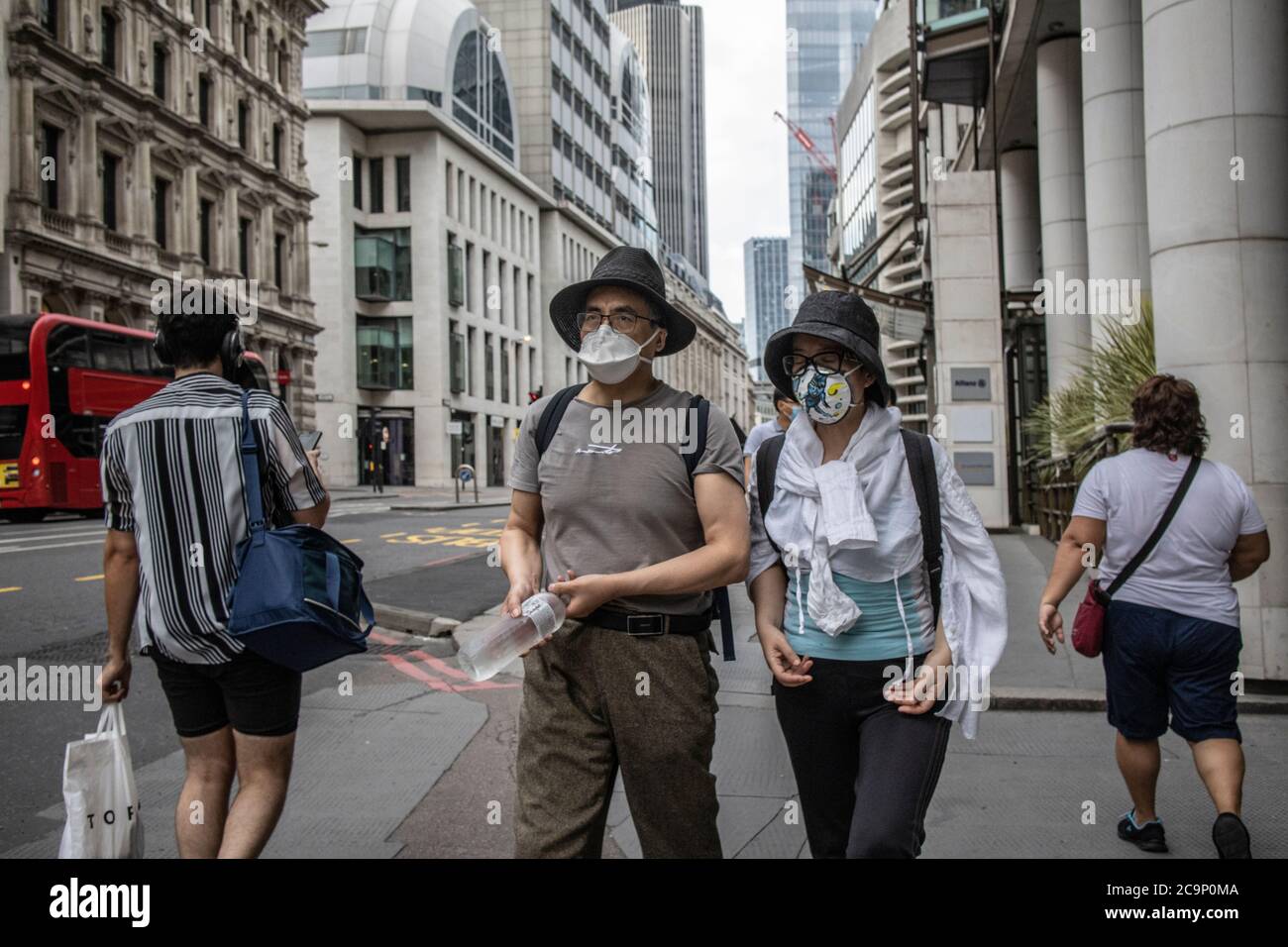 People wearing face masks return to high streets across Soho and the ...
