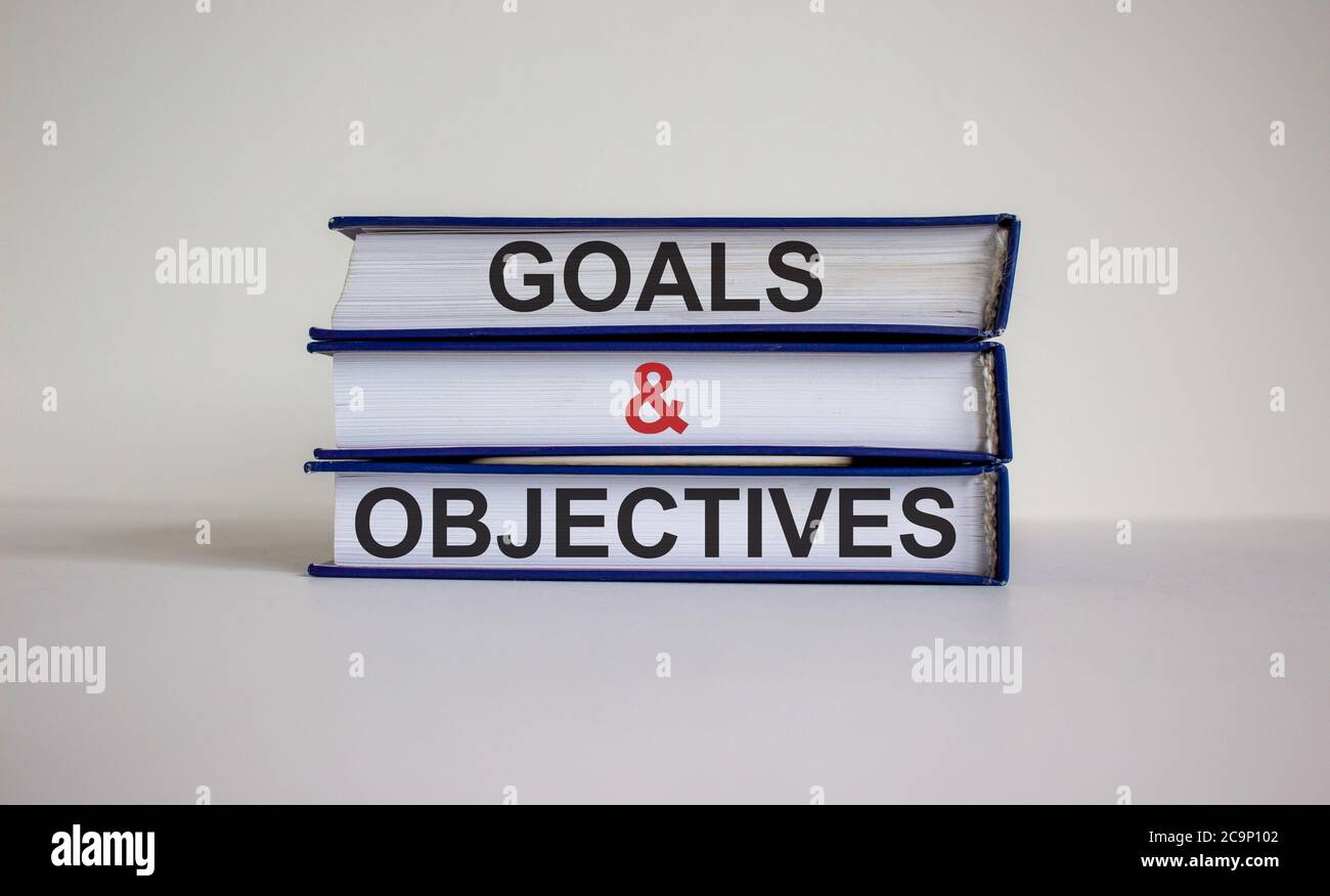 Books with text 'goals and objectives' on beautiful white background ...