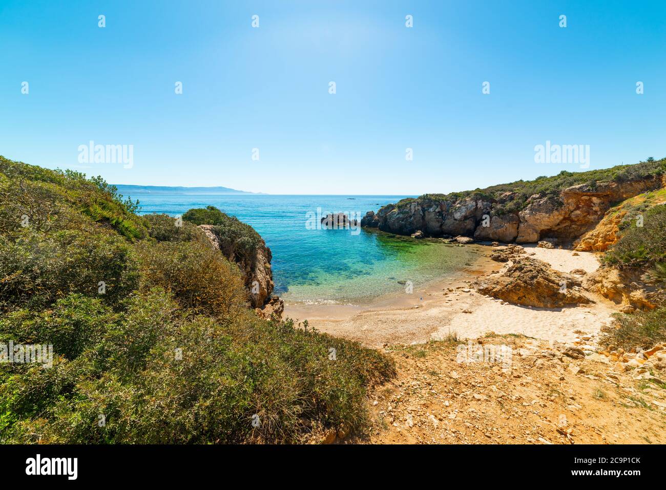 Mediterranean scrub by a small cove in Alghero shore. Sardinia, Italy ...