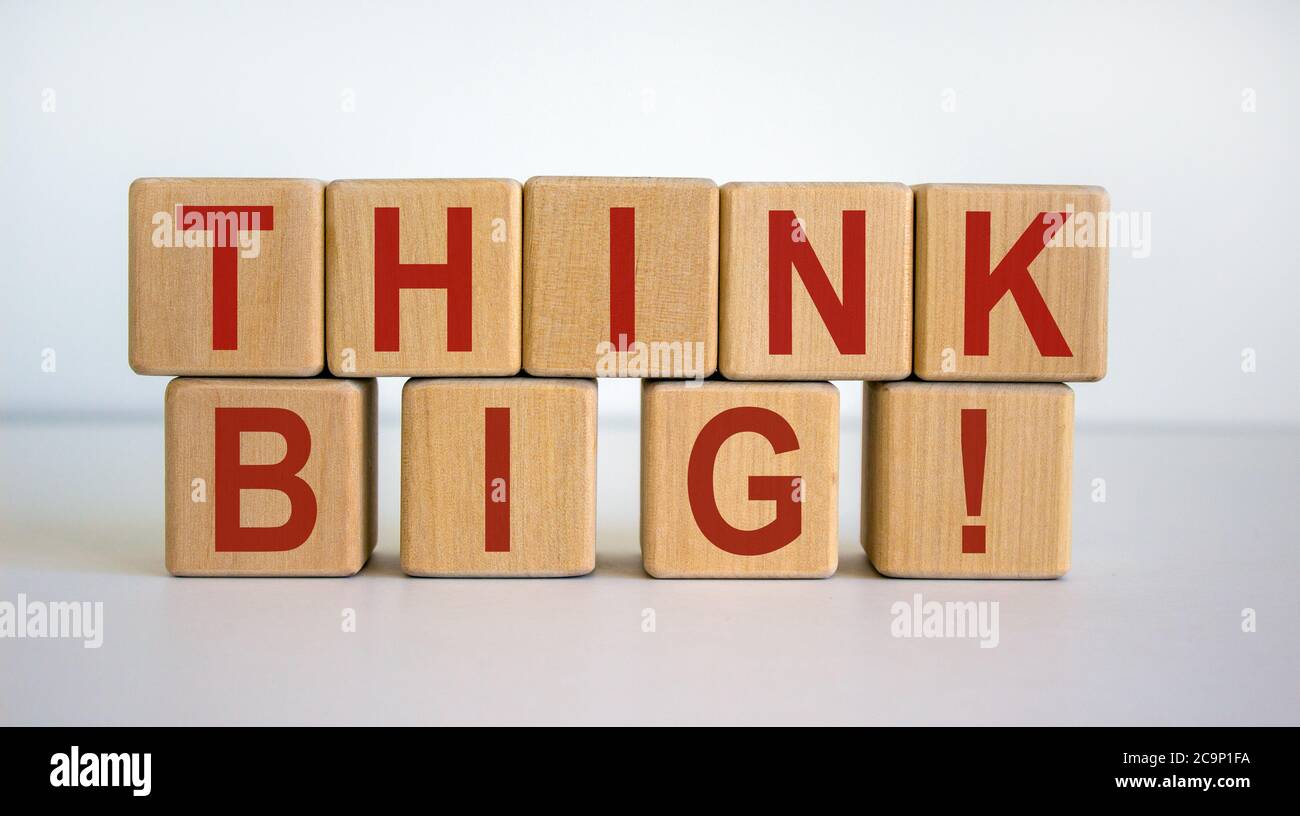 Wooden cubes with the inscription 'think big'. Beautiful white ...
