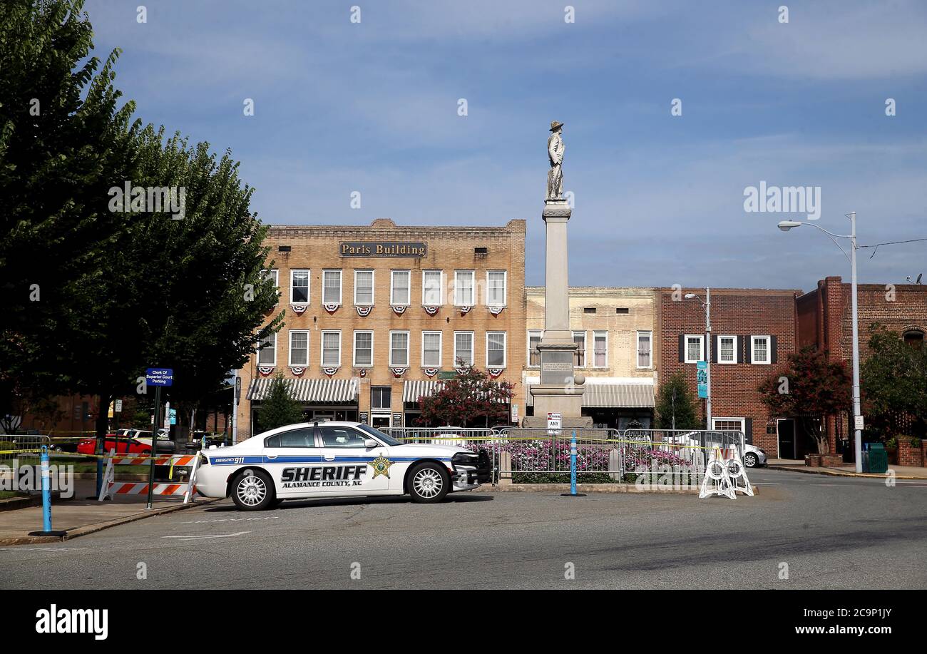 Graham, North Carolina, USA. 1st Aug, 2020. A County Sheriff sits in ...