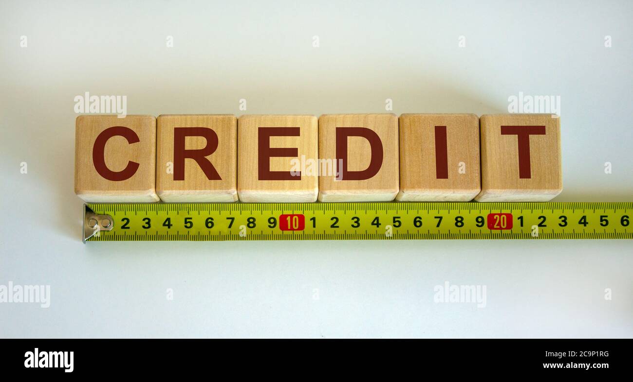 'Credit' word on cubes arranged behind the ruler on beautiful white ...