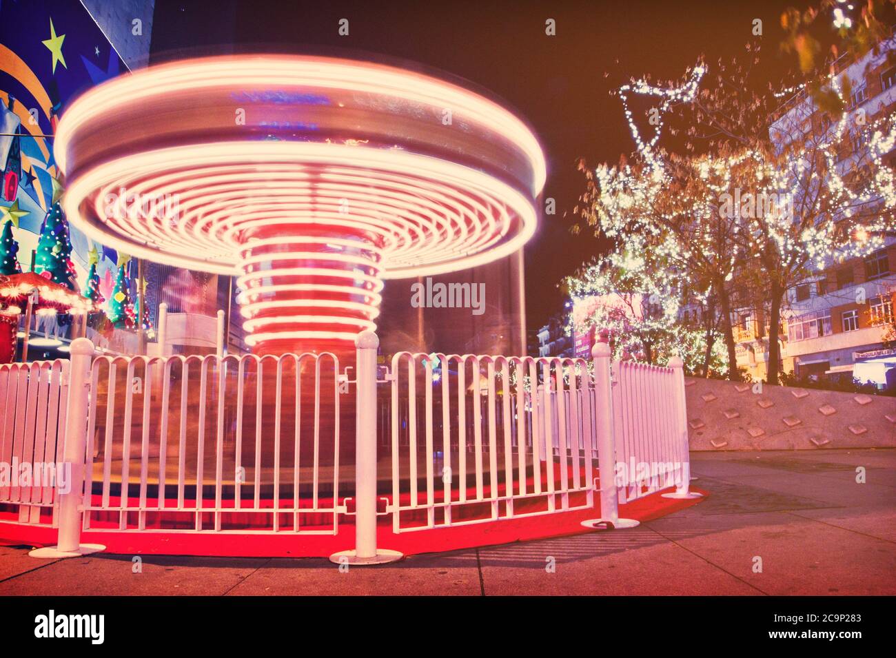 Lights moving on a carousel in Christmas Stock Photo - Alamy