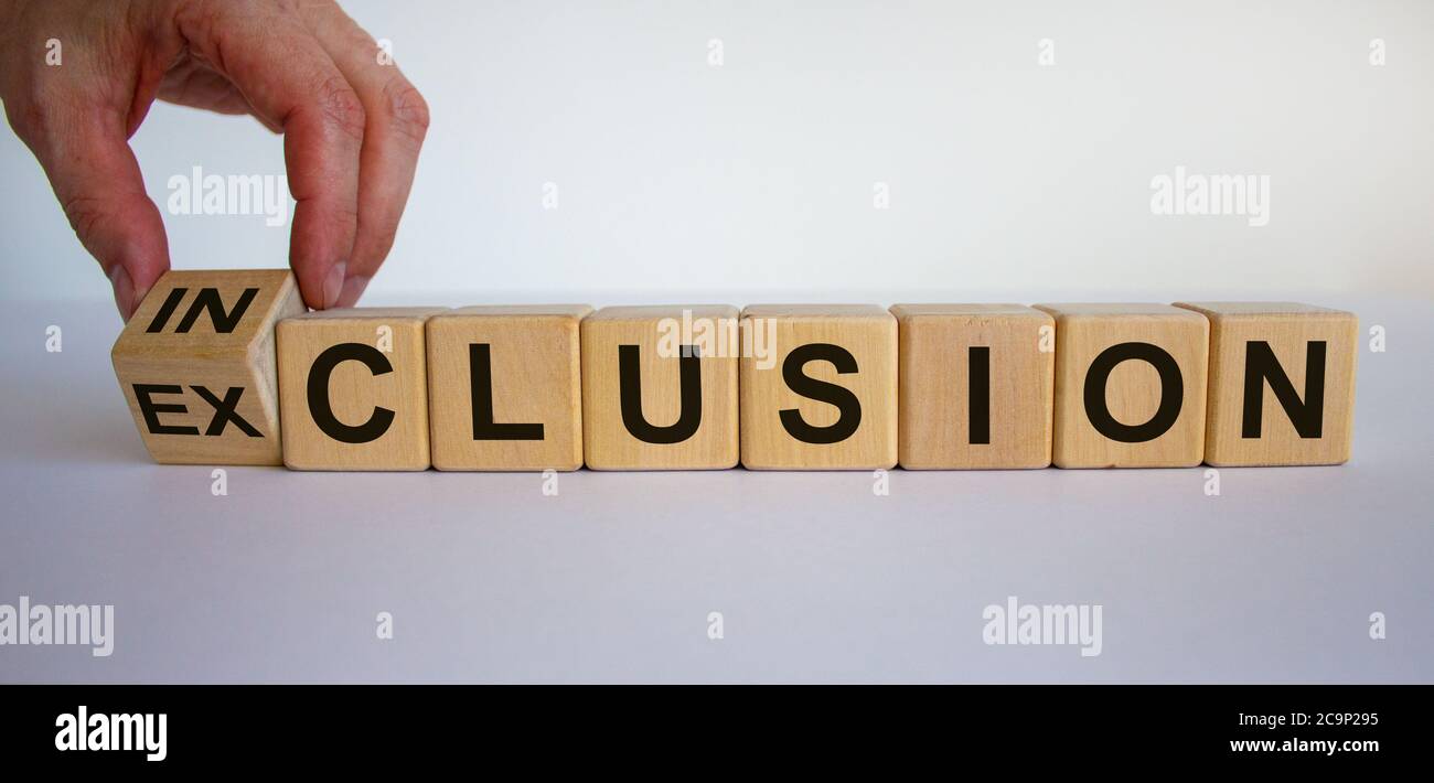 Symbol for a better inclusion. Hand turns cube and changes the word ...