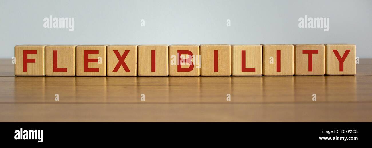 Concept word 'flexibility' on wooden cubes on a beautiful wooden table ...