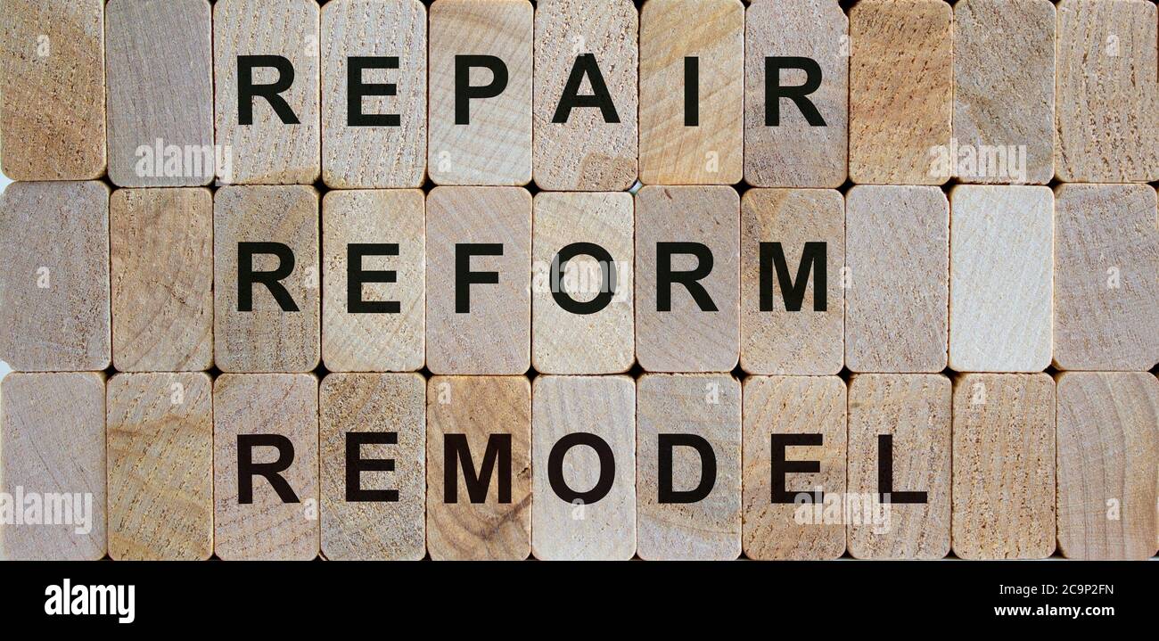 Wooden blocks form the words 'repair reform remodel'. Beautiful wooden ...
