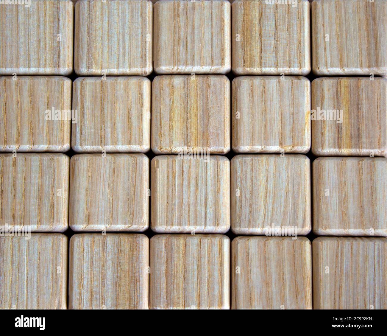 Photo of many small wooden cubes of different heights, tightly lying ...