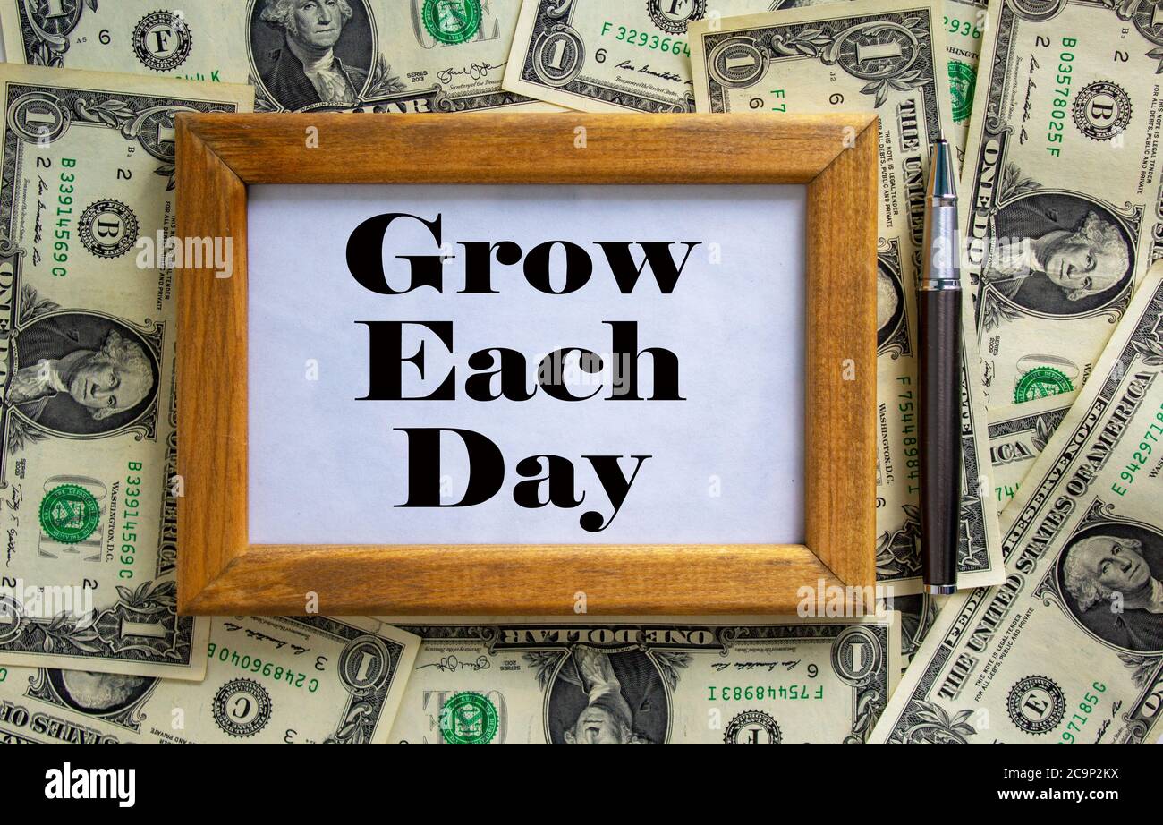 Wooden picture frame with inscription 'grow each day' on beautiful ...