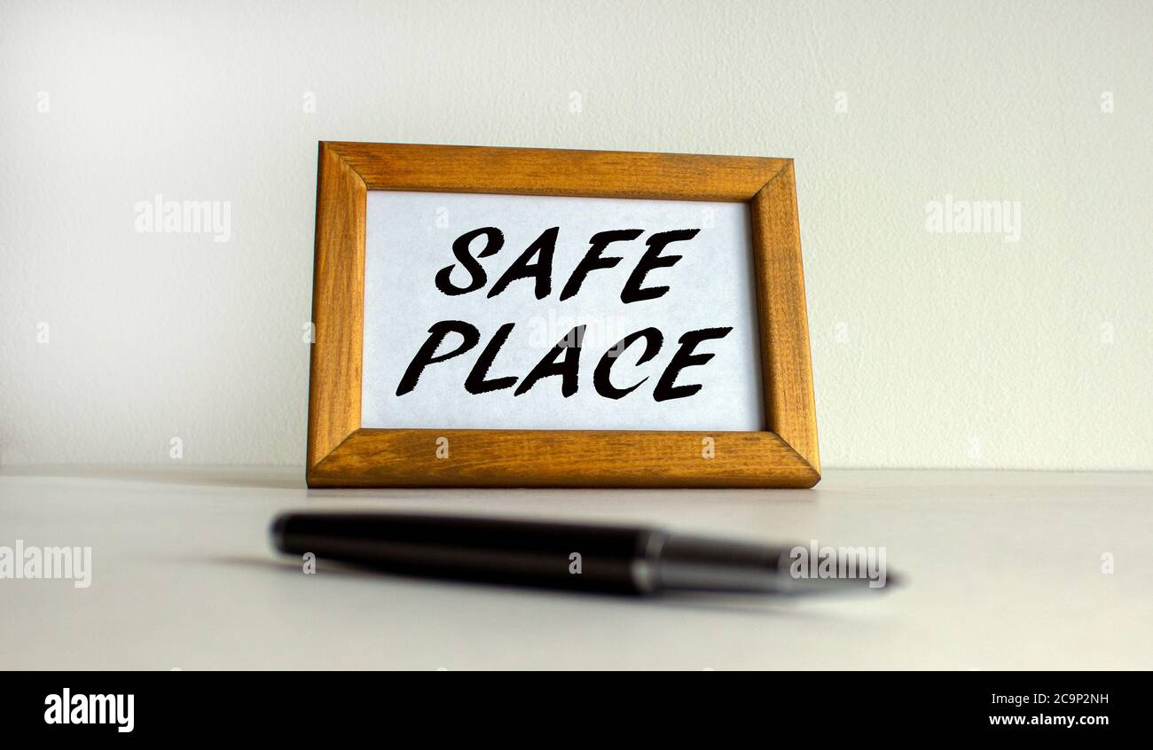 Wooden picture frame with inscription 'safe place' on beautiful white ...