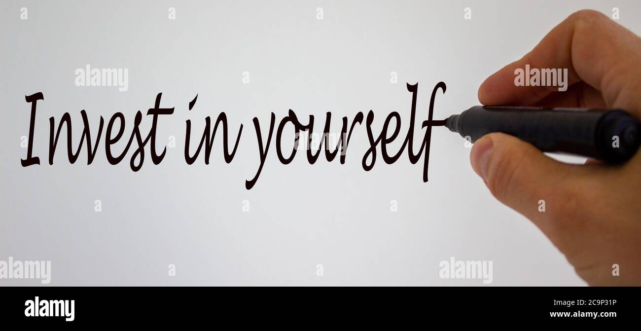 Hand writing 'invest in yourself', isolated on white background Stock ...