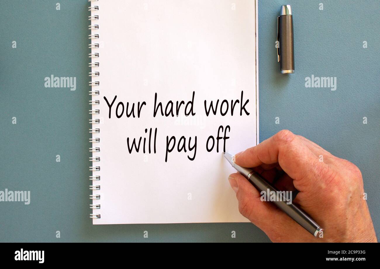 Hand writing 'Your hard work will pay off' on white note, isolated on ...