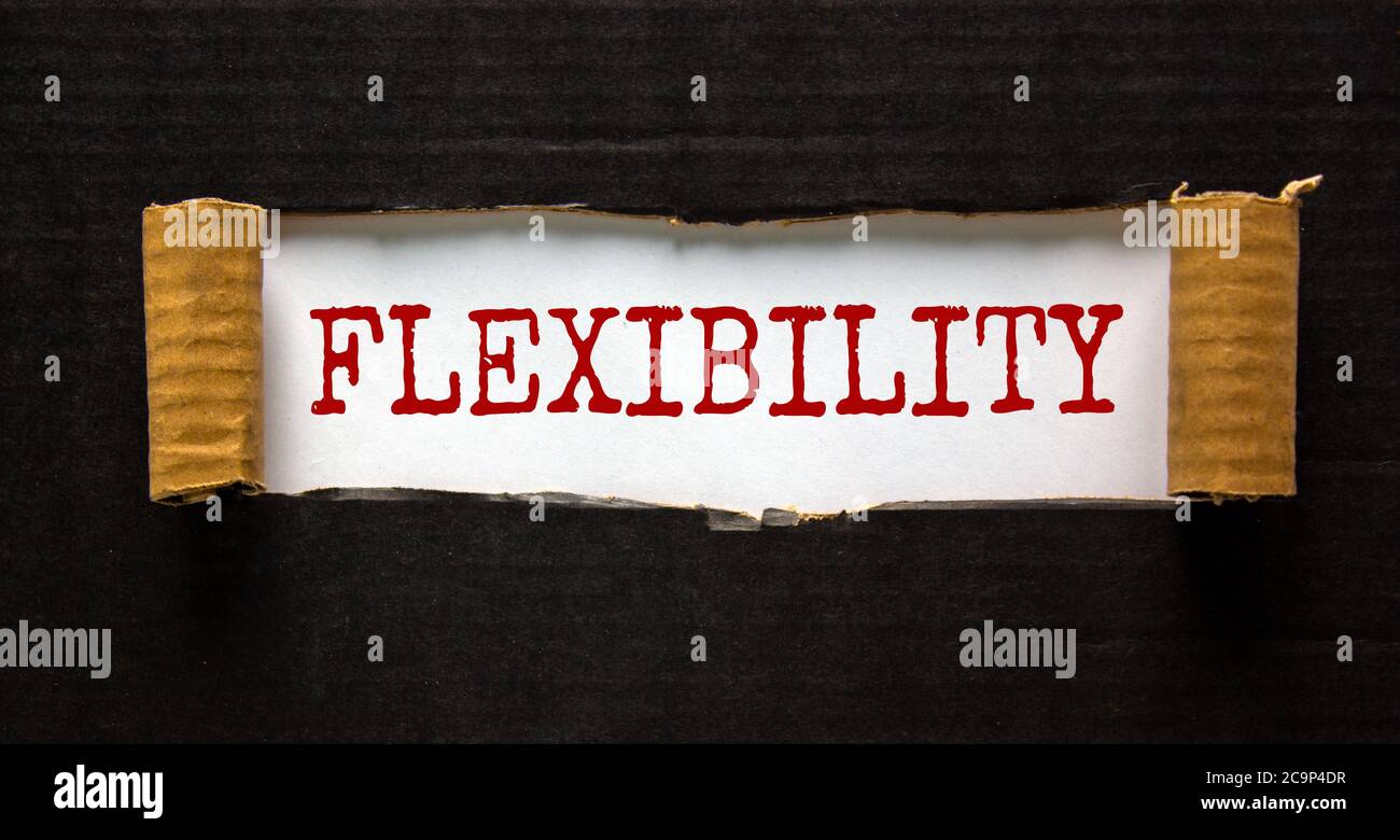 The word 'flexibility' appearing behind torn black paper. Beautiful ...