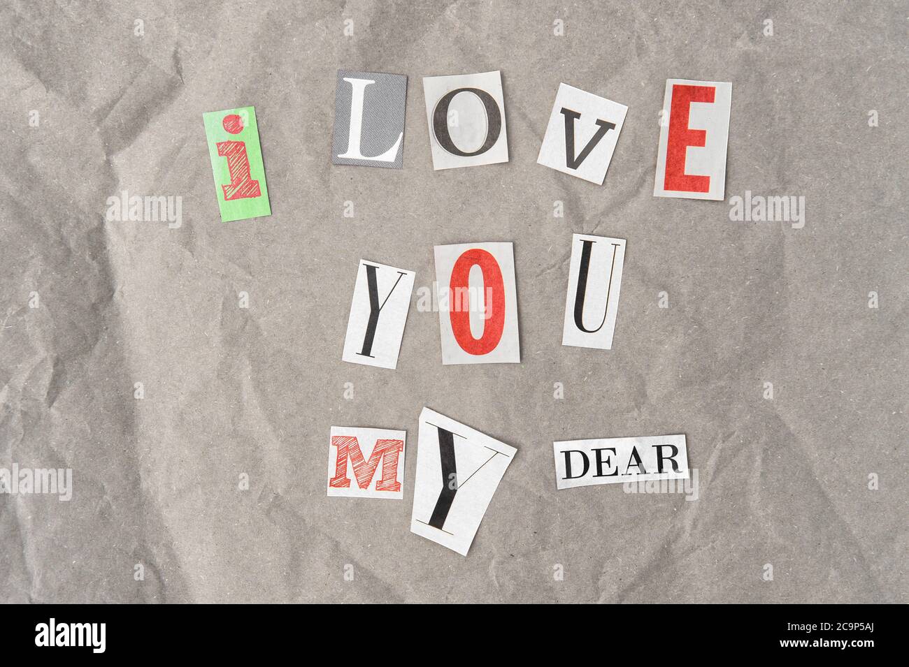 Paper cut letters. Newspaper magazine cutouts. I love you my dear Stock ...