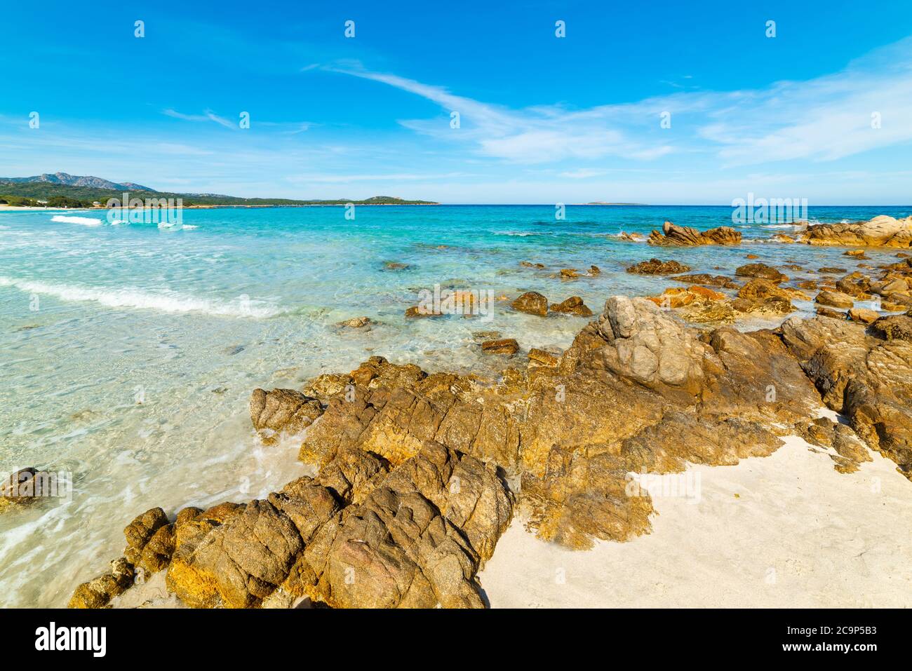 Rocks and sand in Rena Bianca beach in Costa Smeralda. Sardinia, Italy ...