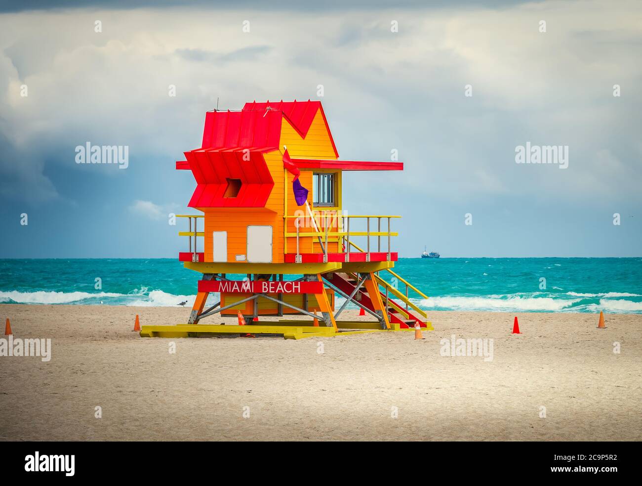 Red and Orange lifeguard hut in South Beach on a cloudy sky. Miami ...