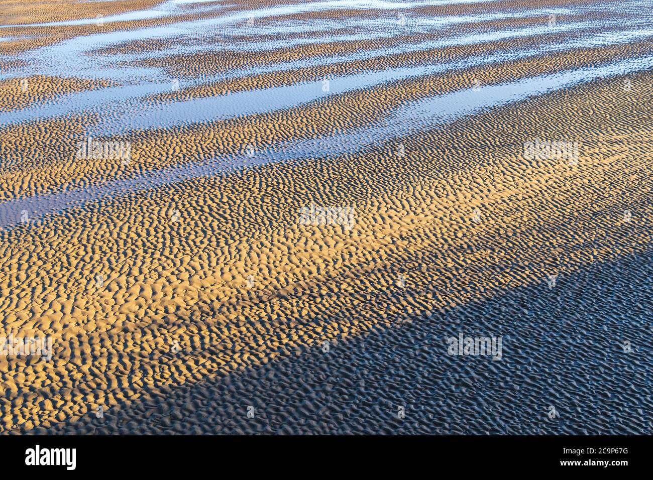 Low tide sand bar patterns Stock Photo - Alamy