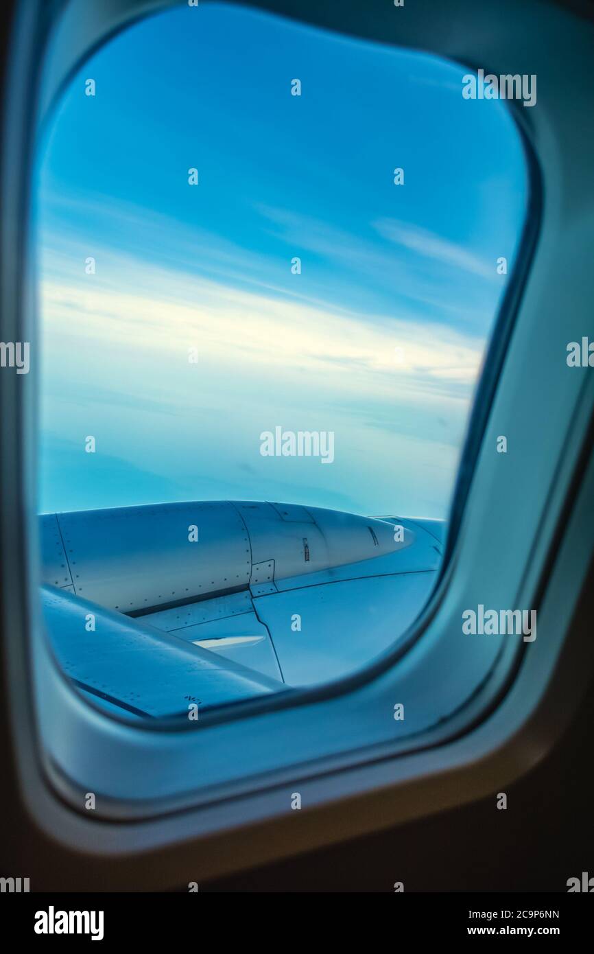 Blue sky seen from a commercial airplane window Stock Photo - Alamy