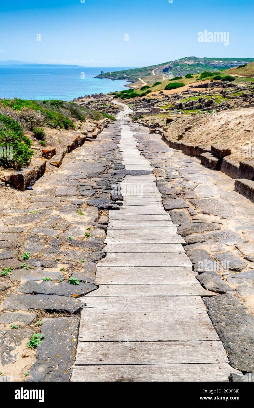 Downhill path to the coast in Tharros archaeological site in springtime ...