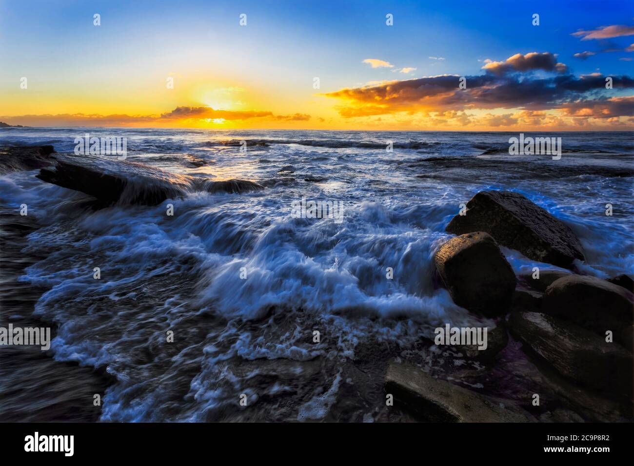 Dark seascape at sunrise with the Sun star over Pacific ocean horizon ...
