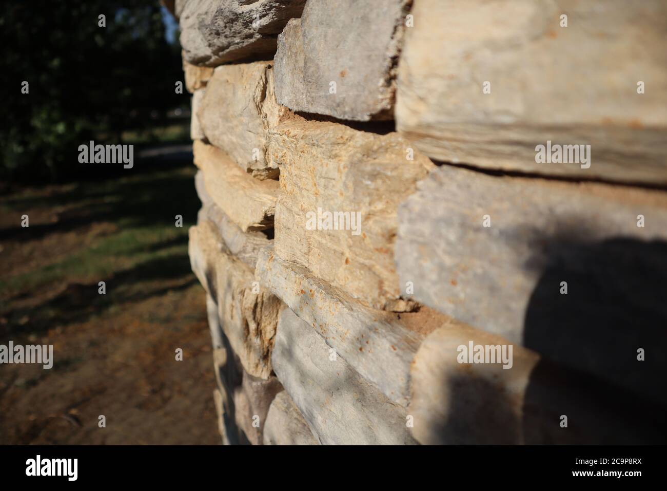 Stone wall curves to the distance Stock Photo - Alamy