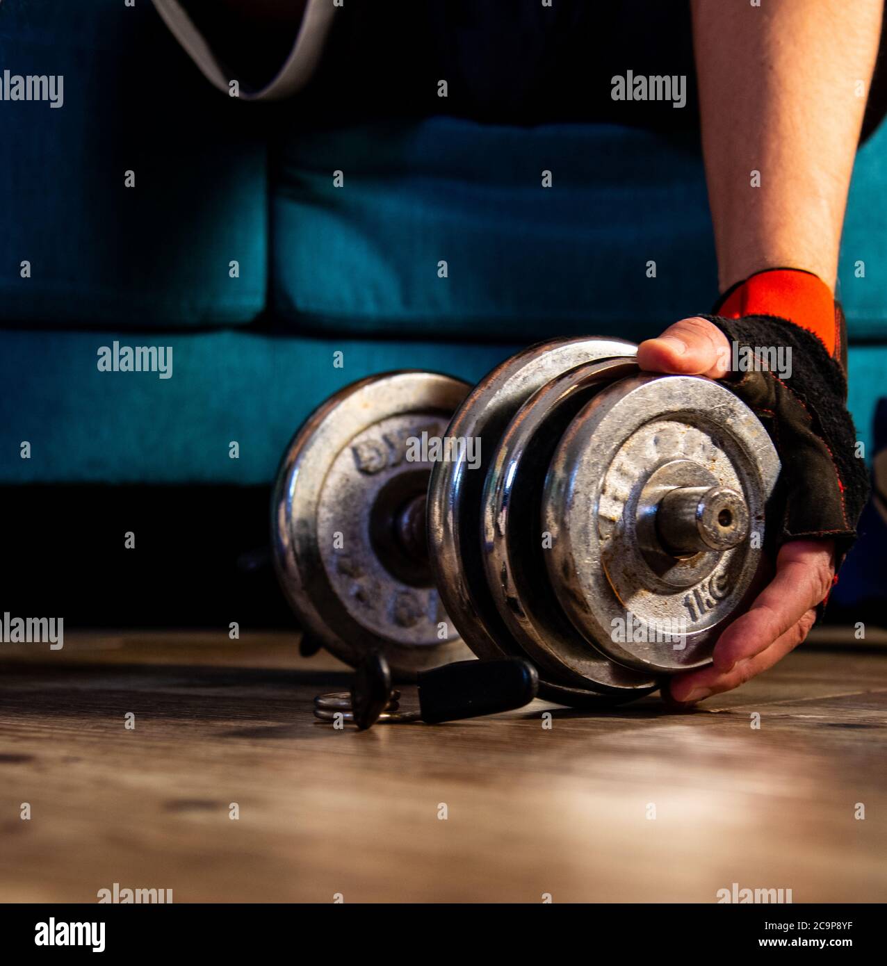 Close up male hand lifting up a dumbbell hi-res stock photography and ...