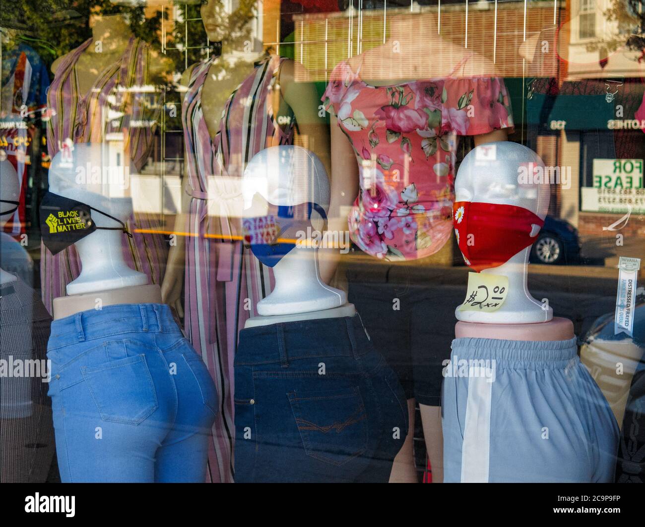 Face masks on mannequin heads in store window. Melrose Park, Illinois ...