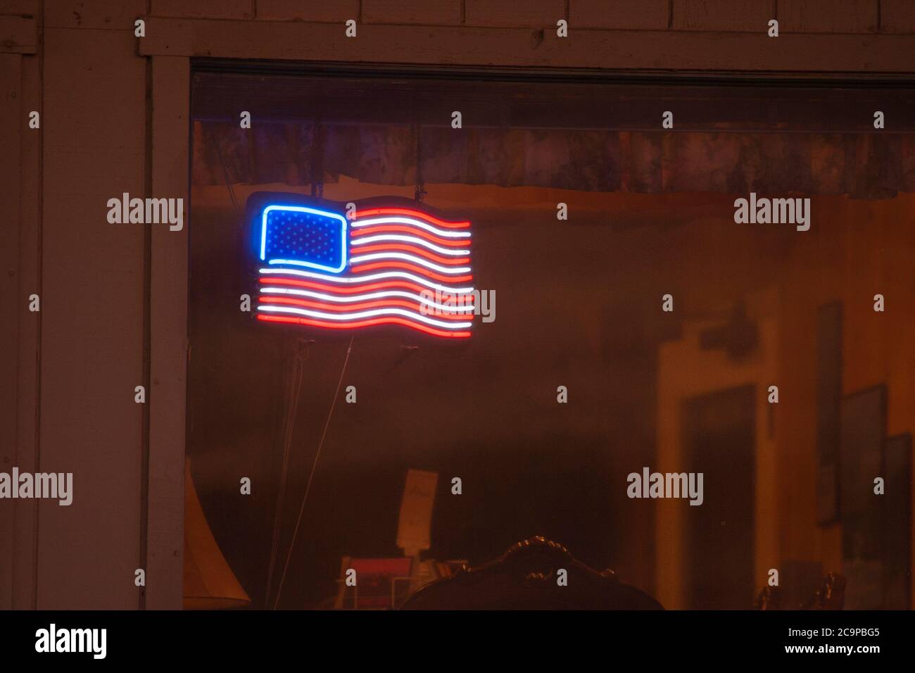Small Neon American Flag in Store Window Stock Photo - Alamy