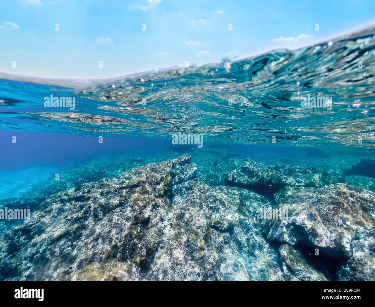 Split underwater view of rocks and blue sea in Sardinia, Italy Stock ...