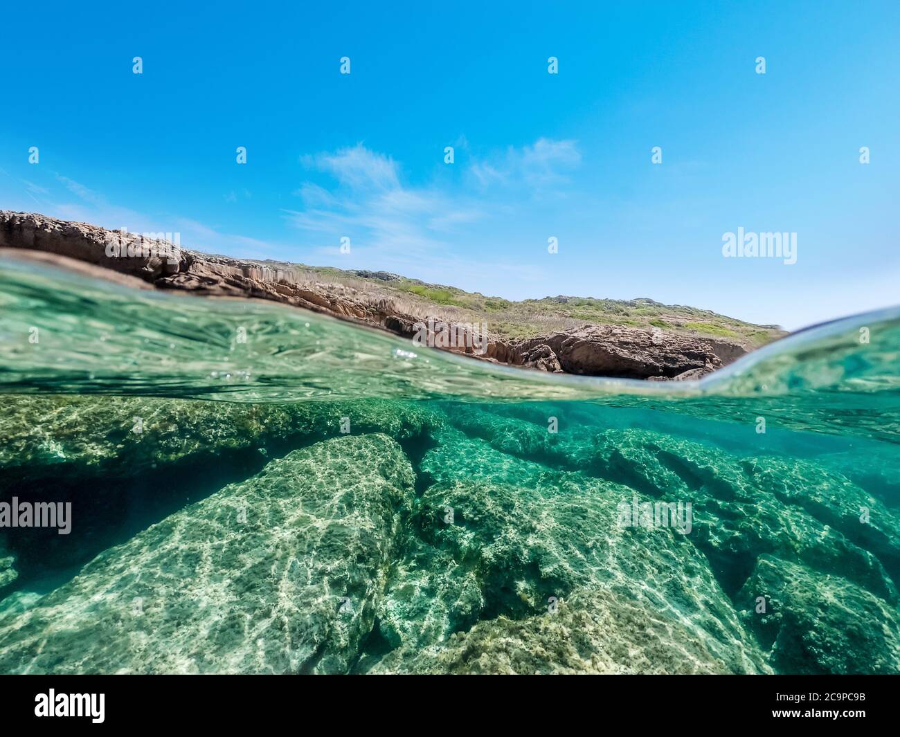 Split underwater view of Sardinia rocky shore, Italy Stock Photo - Alamy