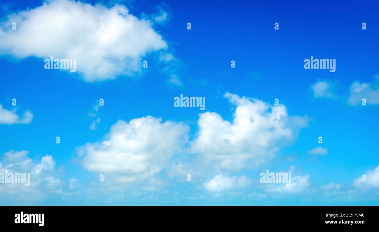 Blue sky with small clouds Stock Photo - Alamy