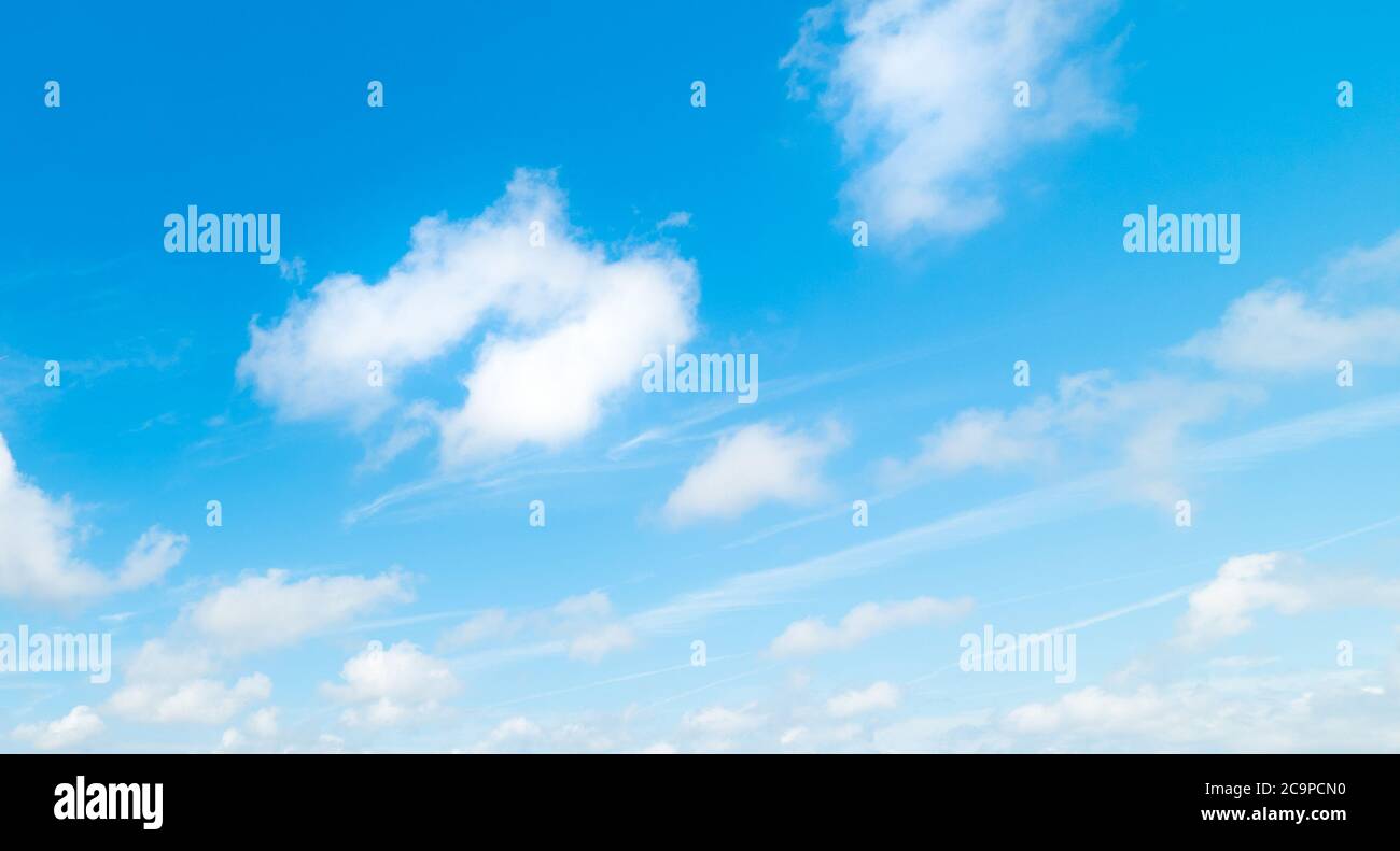 Blue sky with small clouds Stock Photo - Alamy