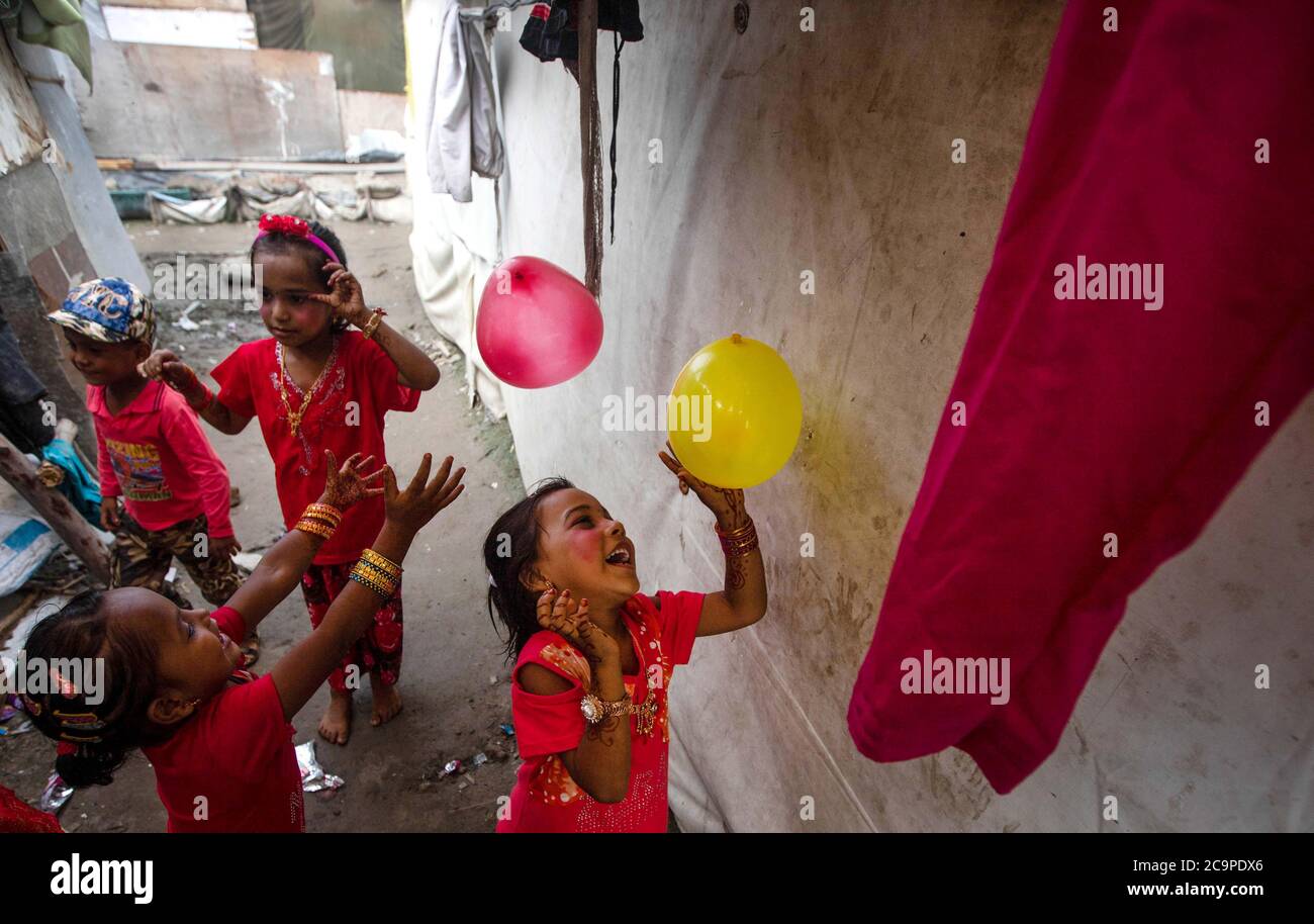 New Delhi, India. 1st Aug, 2020. Rohingya refugee children wear new ...