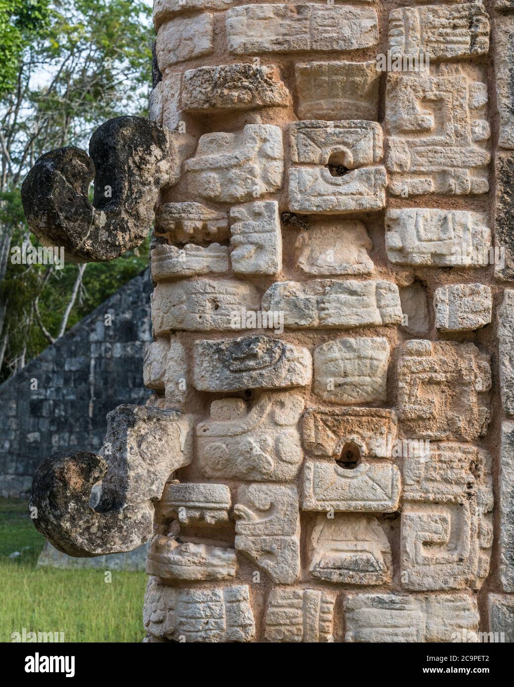A column of chaac masks by the Ossuary or Osario, the Temple of the ...