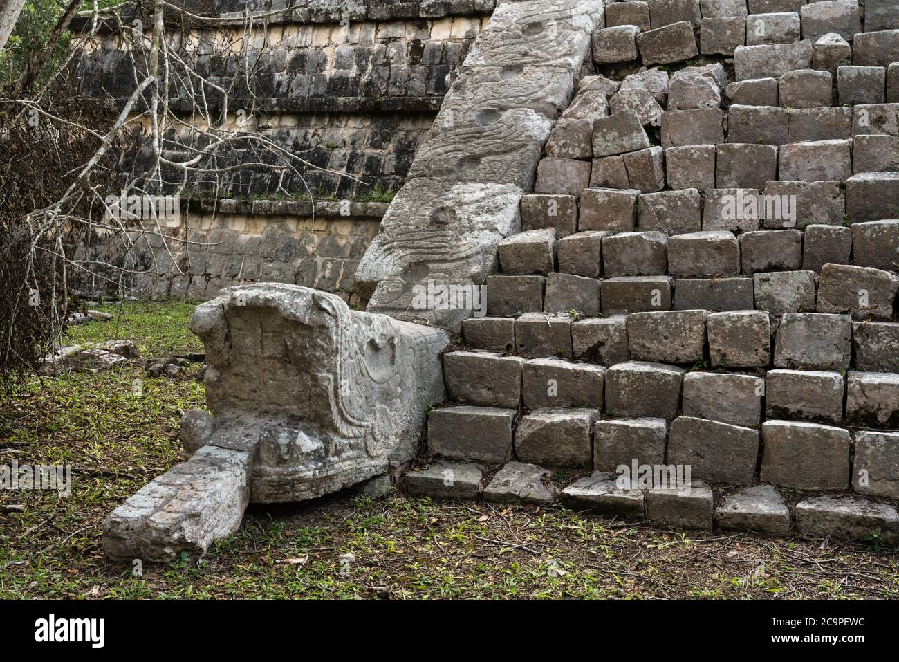 Carved serpent heads at the base of the Ossuary or Osario, the Temple ...