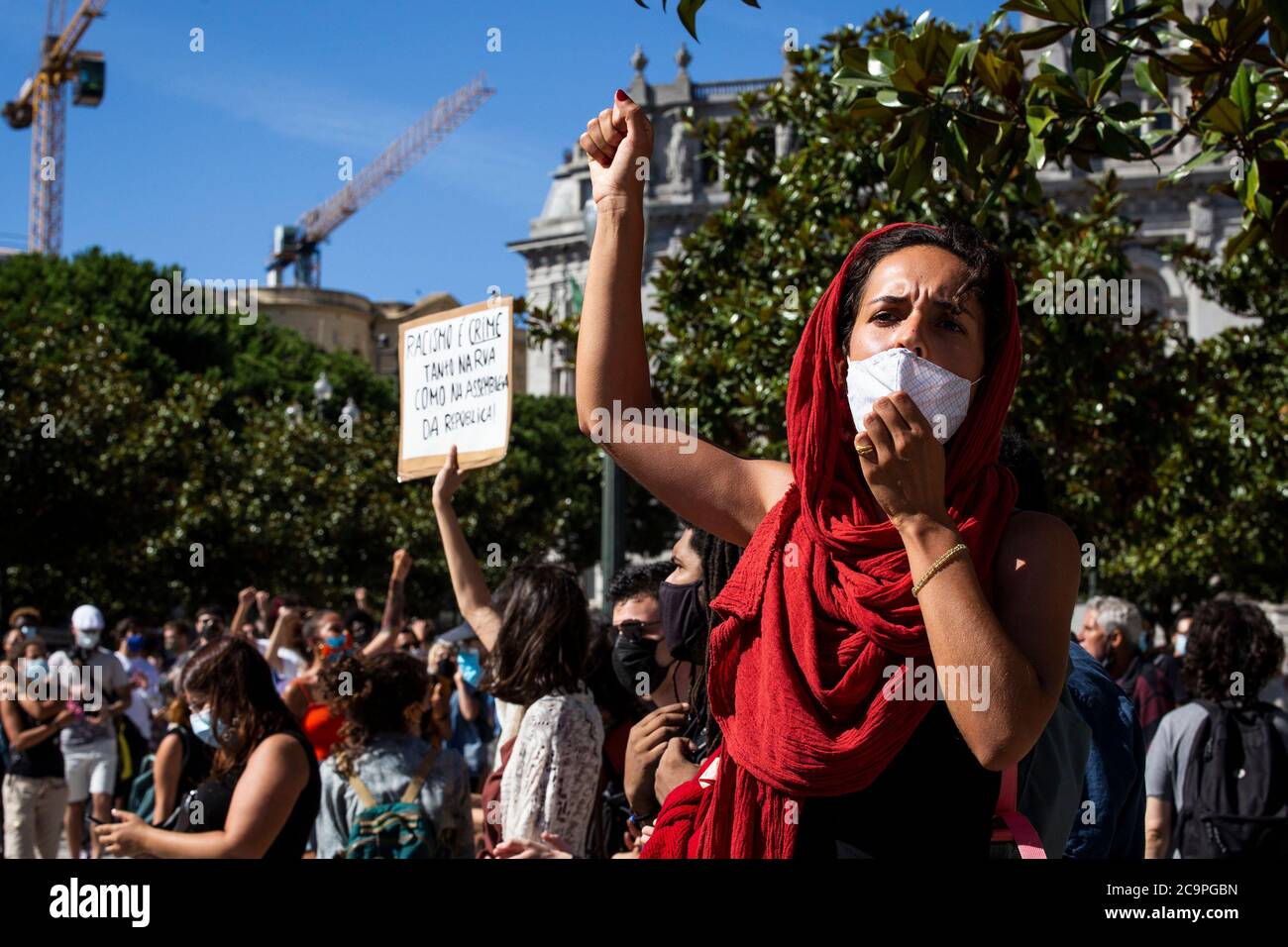 A protester holds up her fist during the demonstration.Hundreds of ...