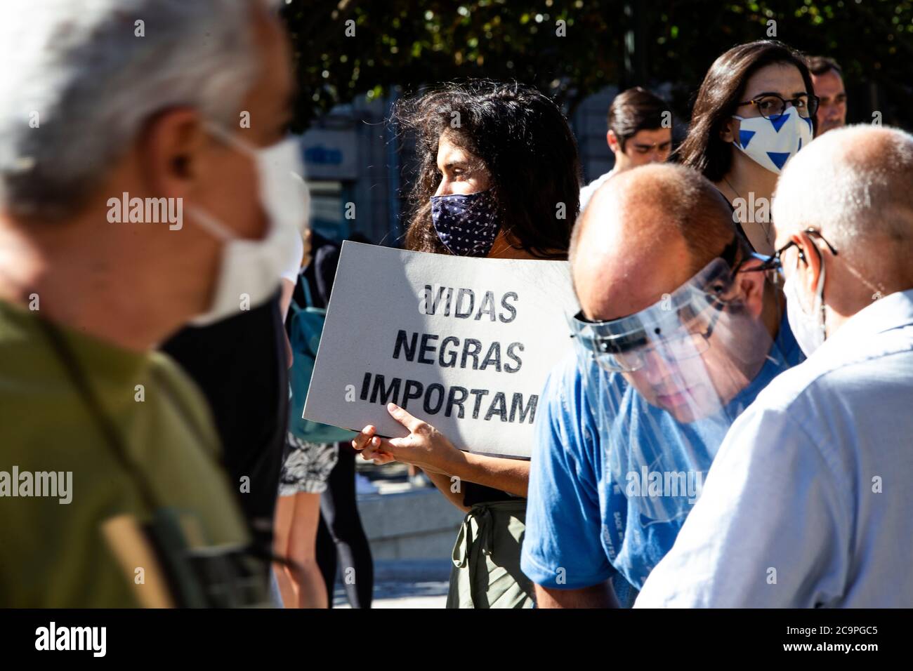 A protester holds a placard during the demonstration.Hundreds of Black ...