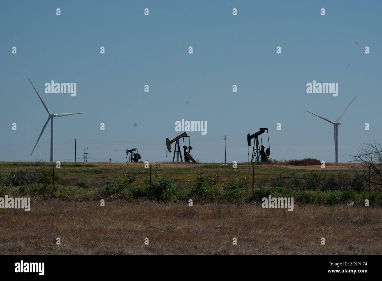 Harrold, TX, USA. 31st July, 2020. The Harrold wind turbines spin as a ...