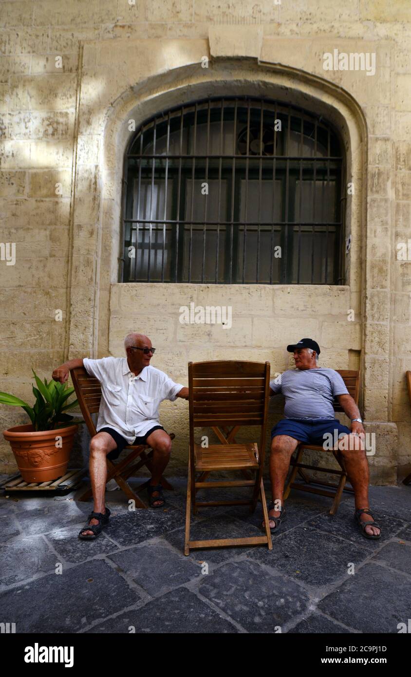 Maltese men socializing in the old town of Valletta Stock Photo - Alamy