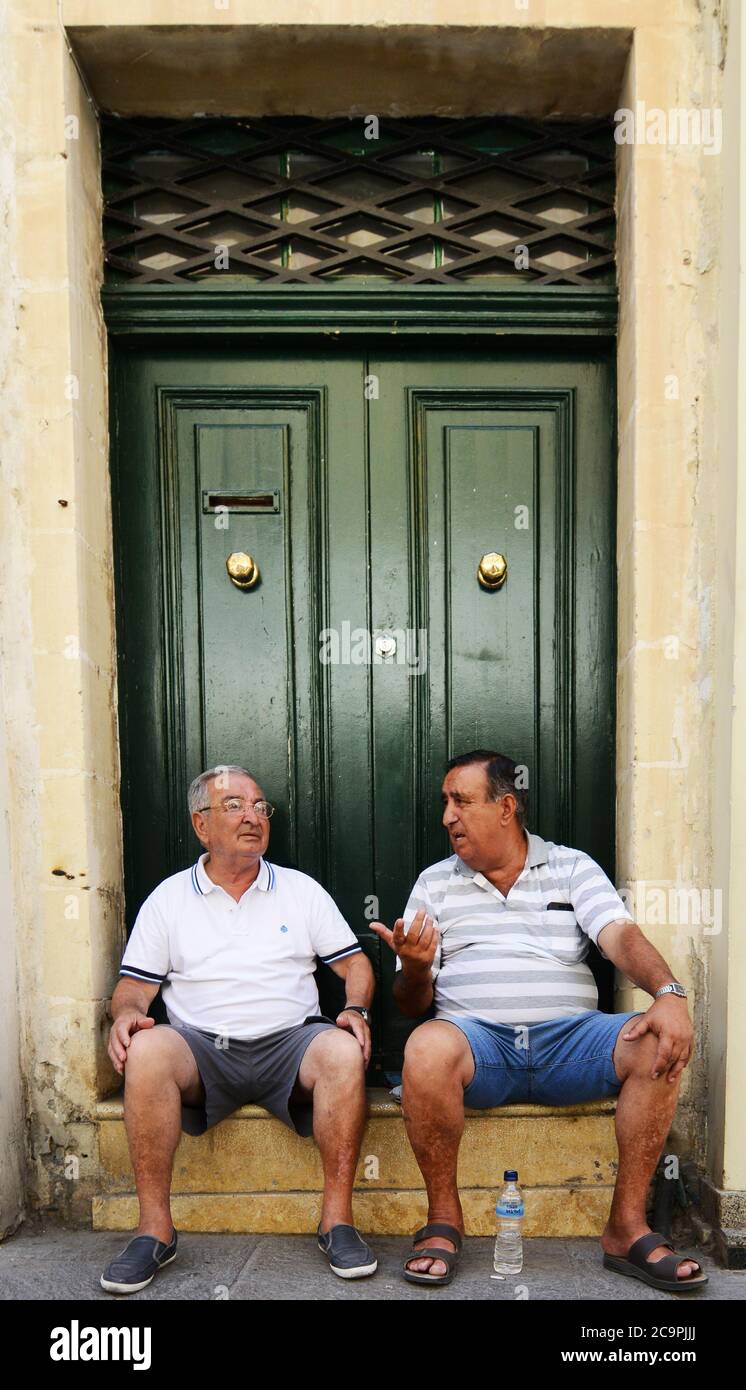 Maltese men socializing in Valletta, Malta Stock Photo - Alamy