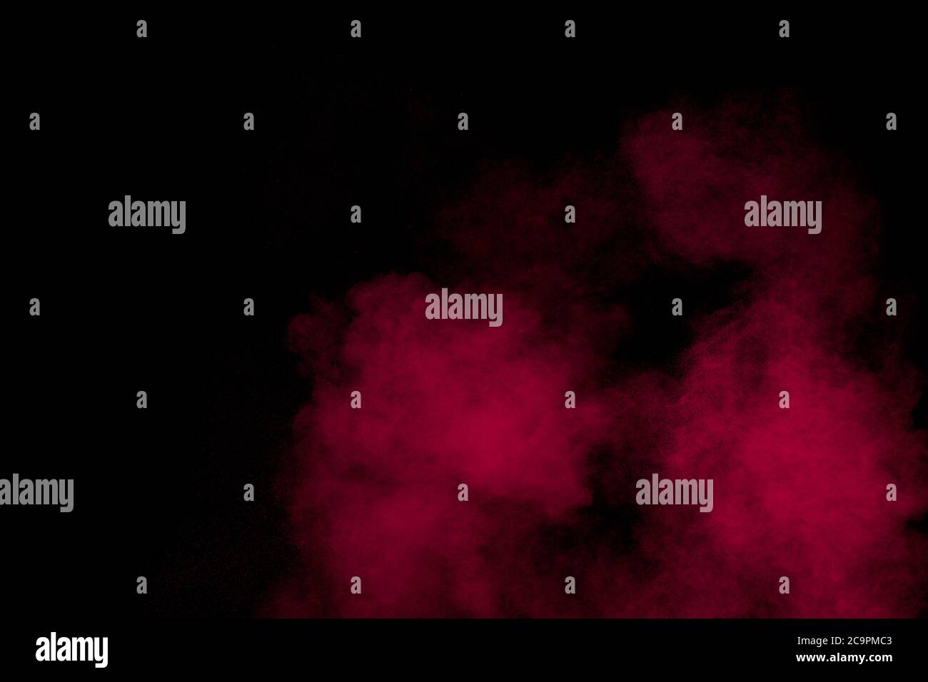 Abstract red powder dust explosion on black background Stock Photo - Alamy