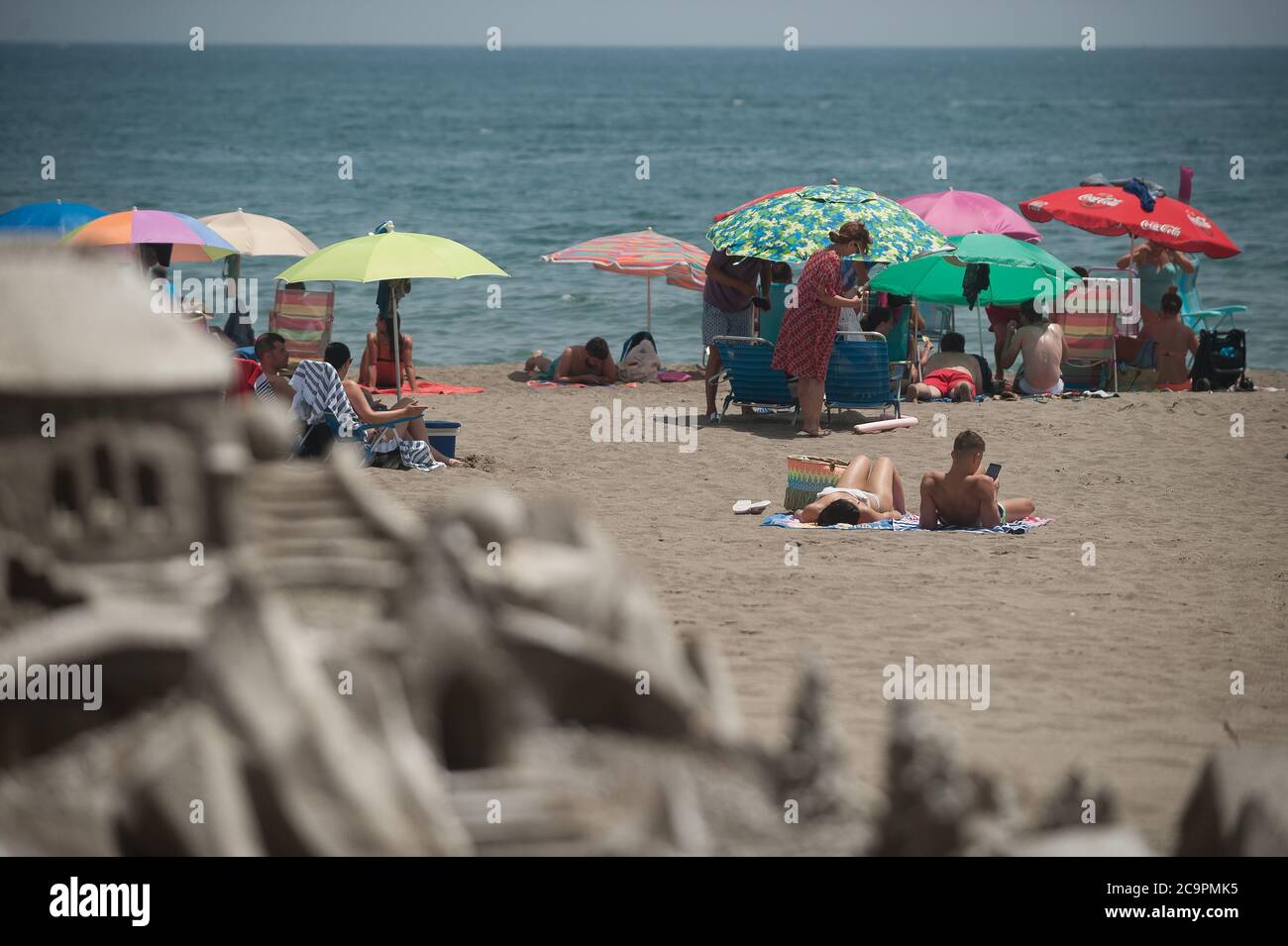 Malaga, Spain. 01st Aug, 2020. A couple sunbathing at Rincon Sol beach ...