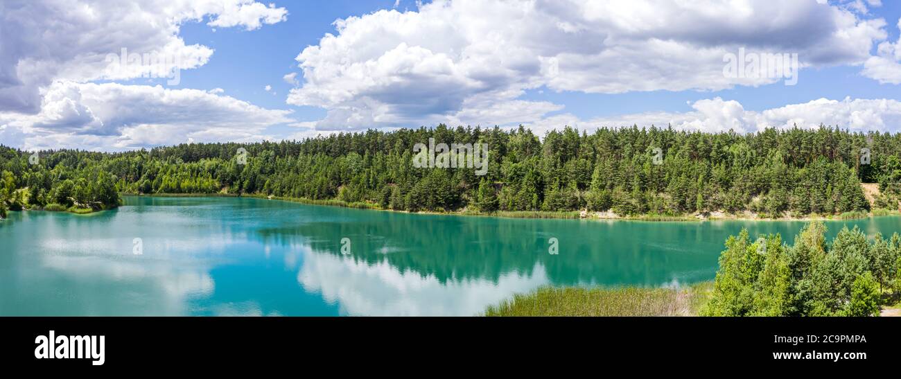 aerial panoramic view of abandoned quarry flooded with turquoise clear ...