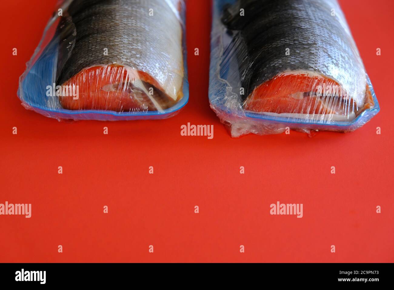 Fresh salmon wrapped from fridge to be cooked Stock Photo - Alamy