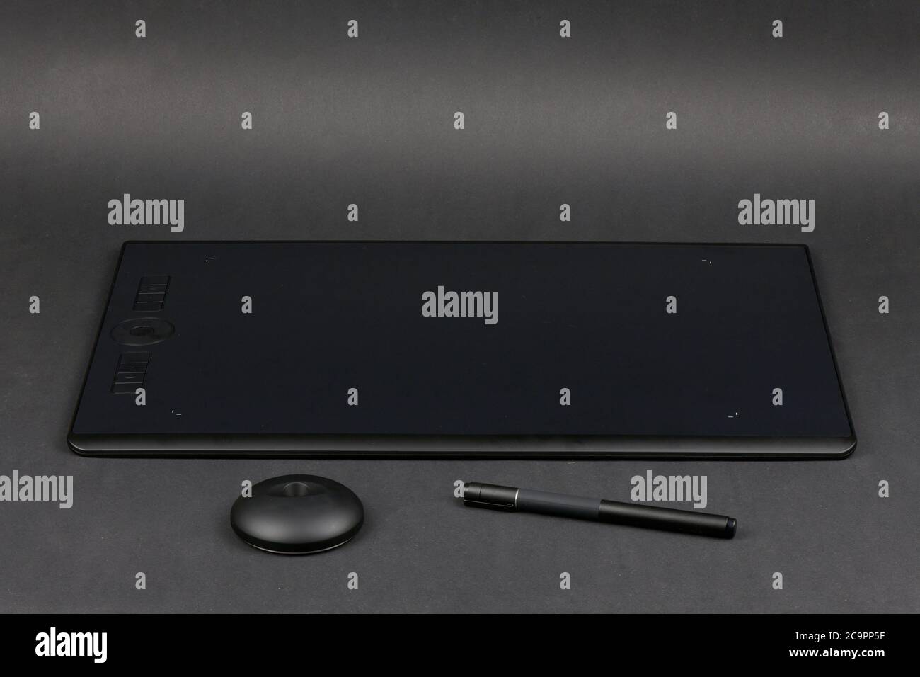 Professional graphics tablet with digitized pen. Isolated on black ...