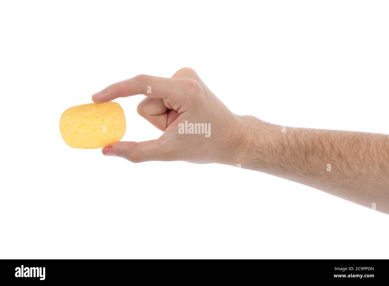 Male hand holding potato chip. Isolated on white background. High ...