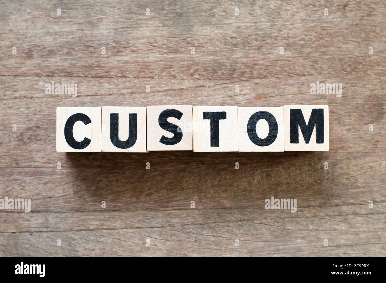 Alphabet letter block in word custom on wood background Stock Photo - Alamy