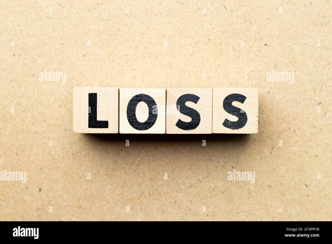 Letter block in word loss on wood background Stock Photo - Alamy