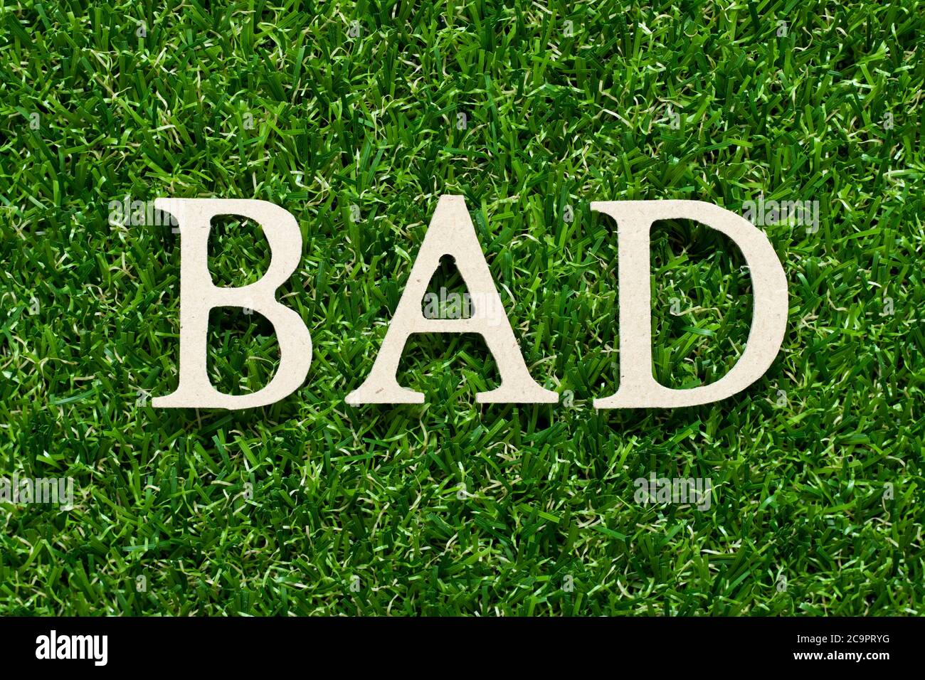 Wood alphabet letter in word bad on green grass background Stock Photo ...