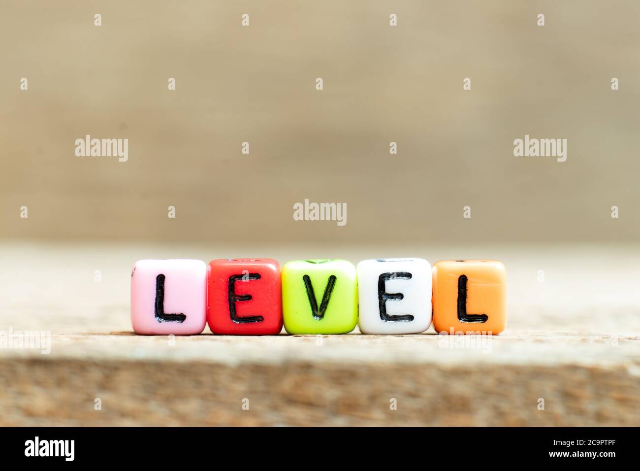 Colorful bead with black letter in word level on wood background Stock ...